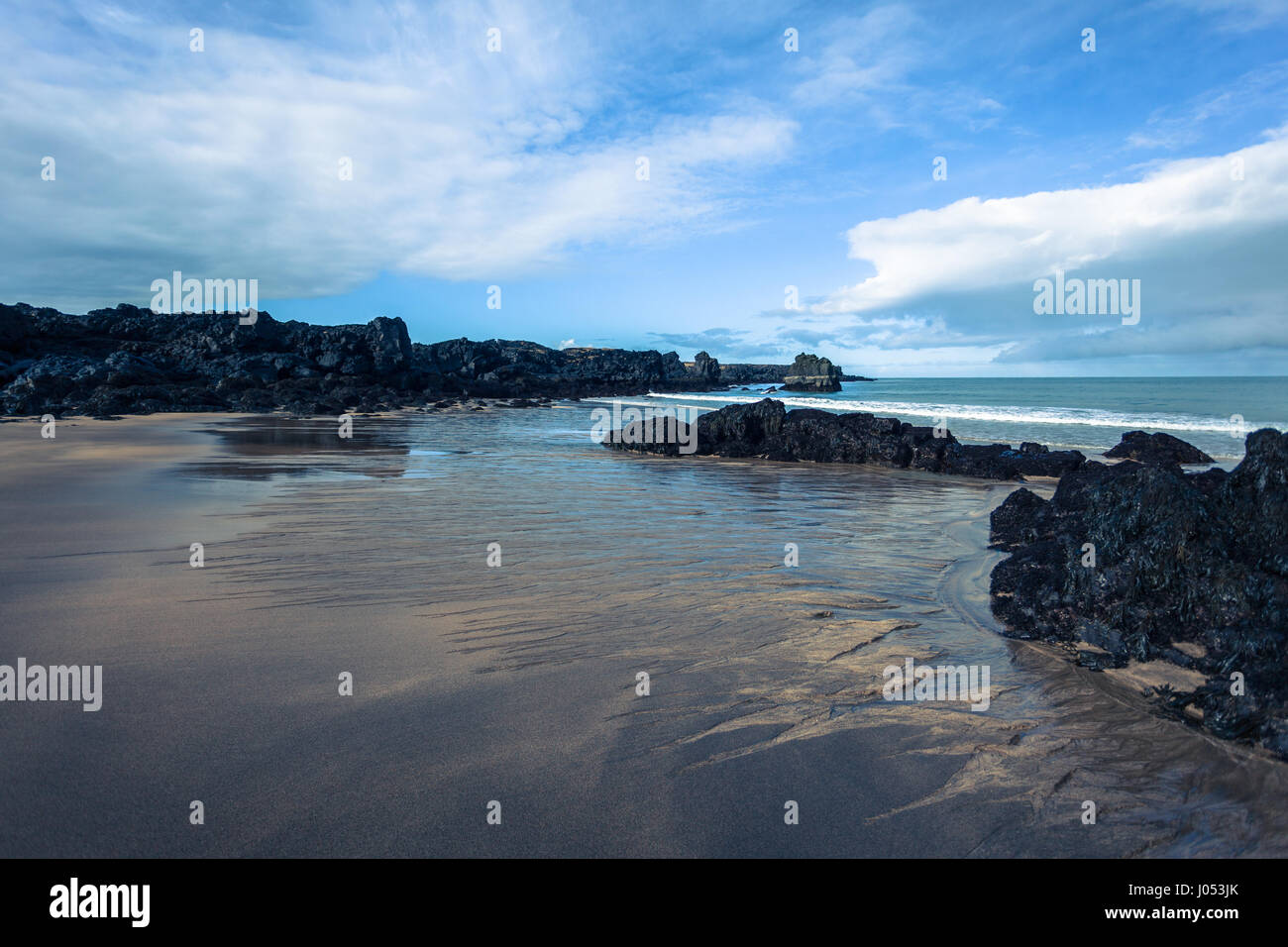 Tide marks and golden sand on Skarðsvík beach, Snaefellsnes peninsula ...