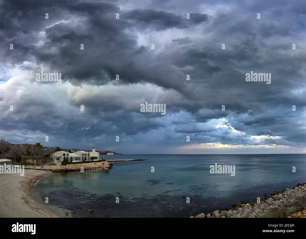 Exciting seascape with calm sea and stormy clouds Stock Photo - Alamy