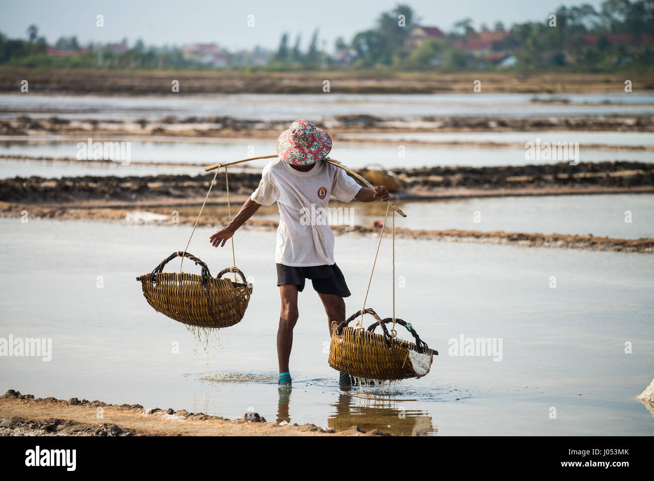 Local people working in the salt fields of Kampot, Cambodia, Asia Stock ...