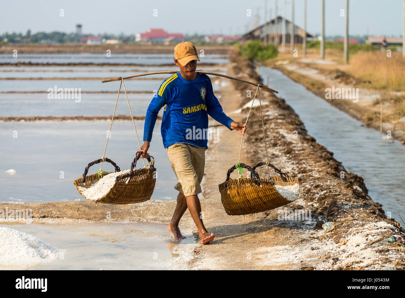 Local people working in the salt fields of Kampot, Cambodia, Asia Stock ...