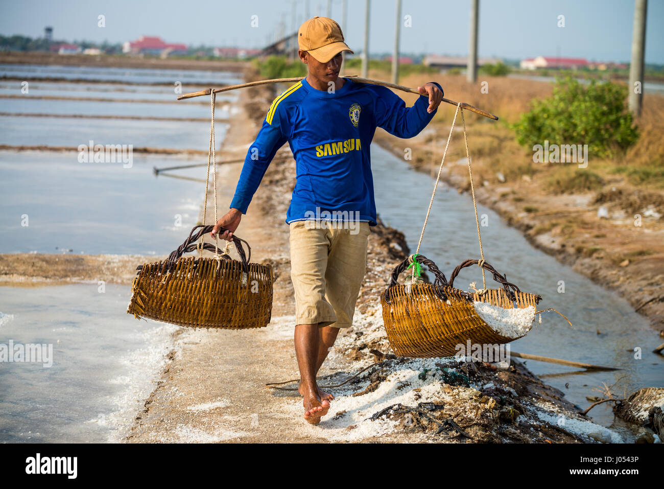 Local people working in the salt fields of Kampot, Cambodia, Asia Stock ...