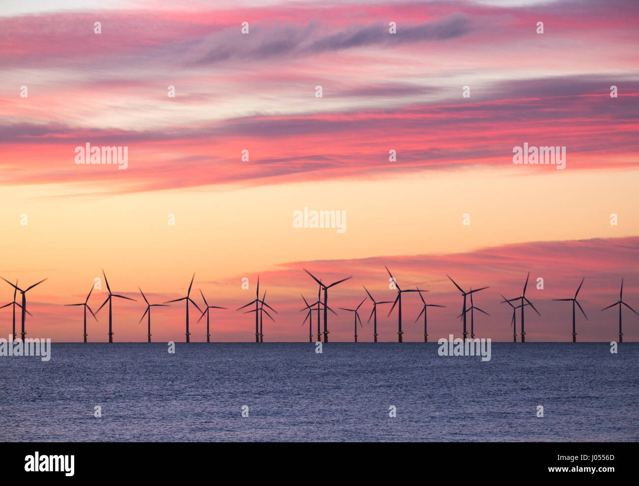 Ship passing Teesside Offshore Wind farm on the north east coast of ...
