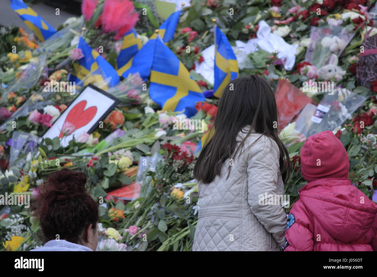 Young kids mourning Stockholm terrorist attack at Sergels Torg square ...