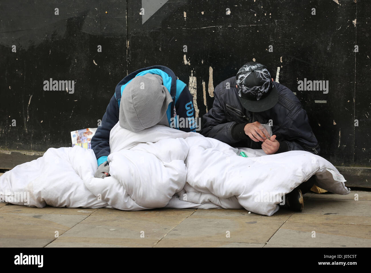 Manchester, UK. 10th Apr, 2017. Young homeless people sitting under a ...