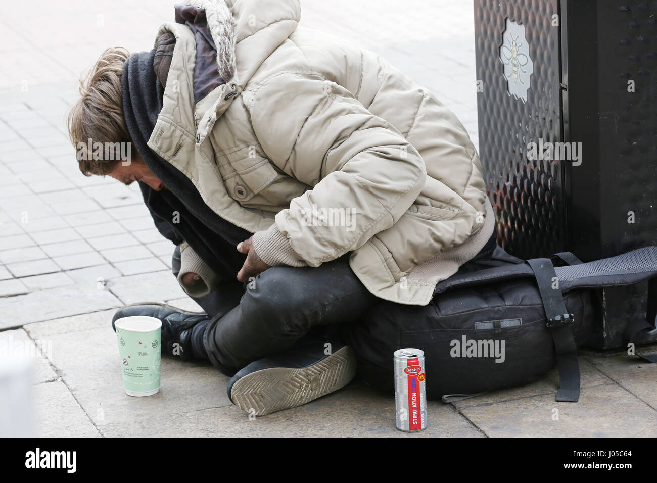 Manchester, UK. 10th Apr, 2017. A homeless man who appears to be under ...