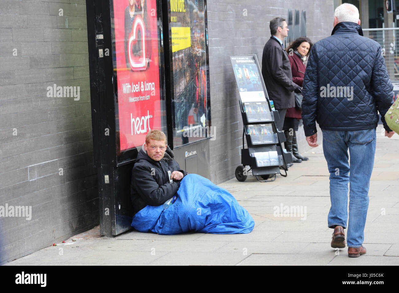 Manchester, UK. 10th Apr, 2017. A homeless man sitting in a sleeping ...
