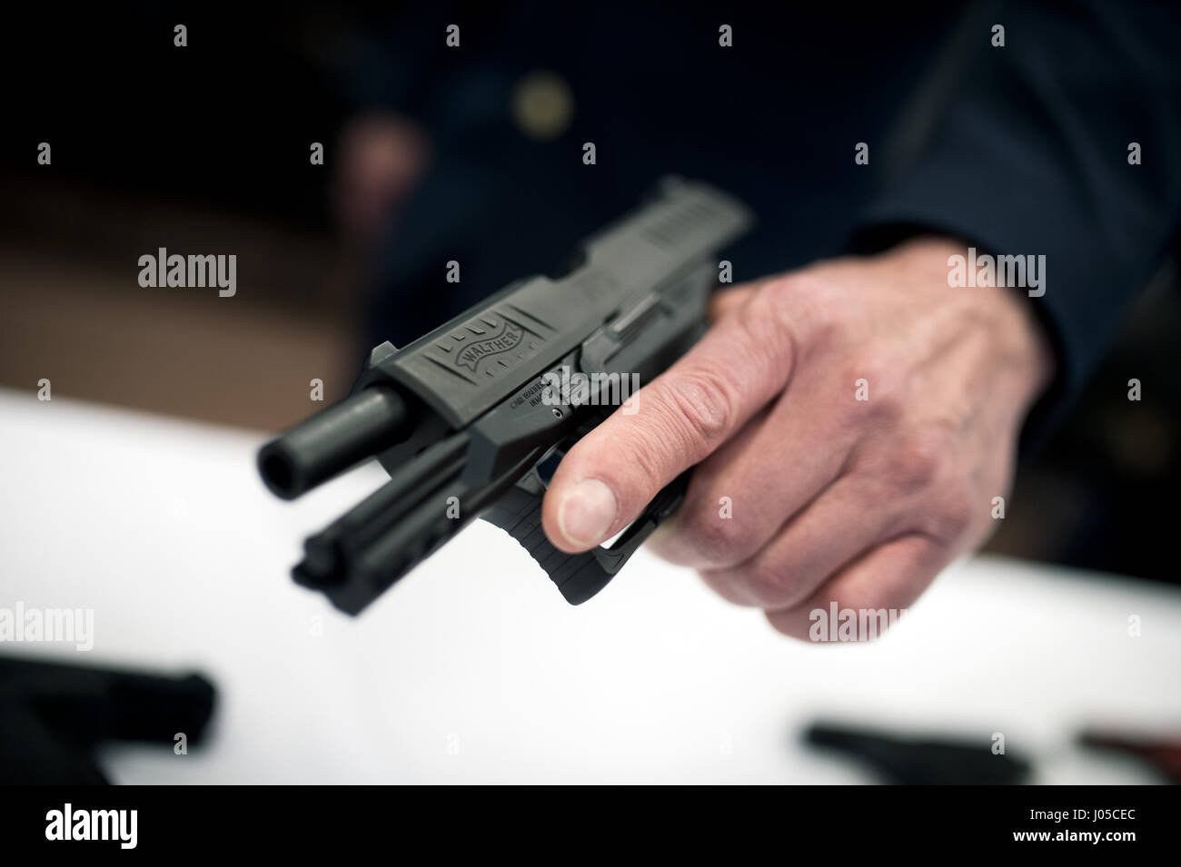 A police officer presents the possible new service weapon Walter PPQ P3 ...