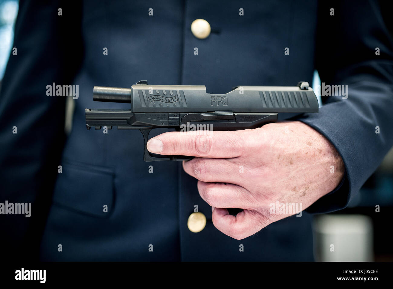 A police officer presents the possible new service weapon Walter PPQ P3 ...