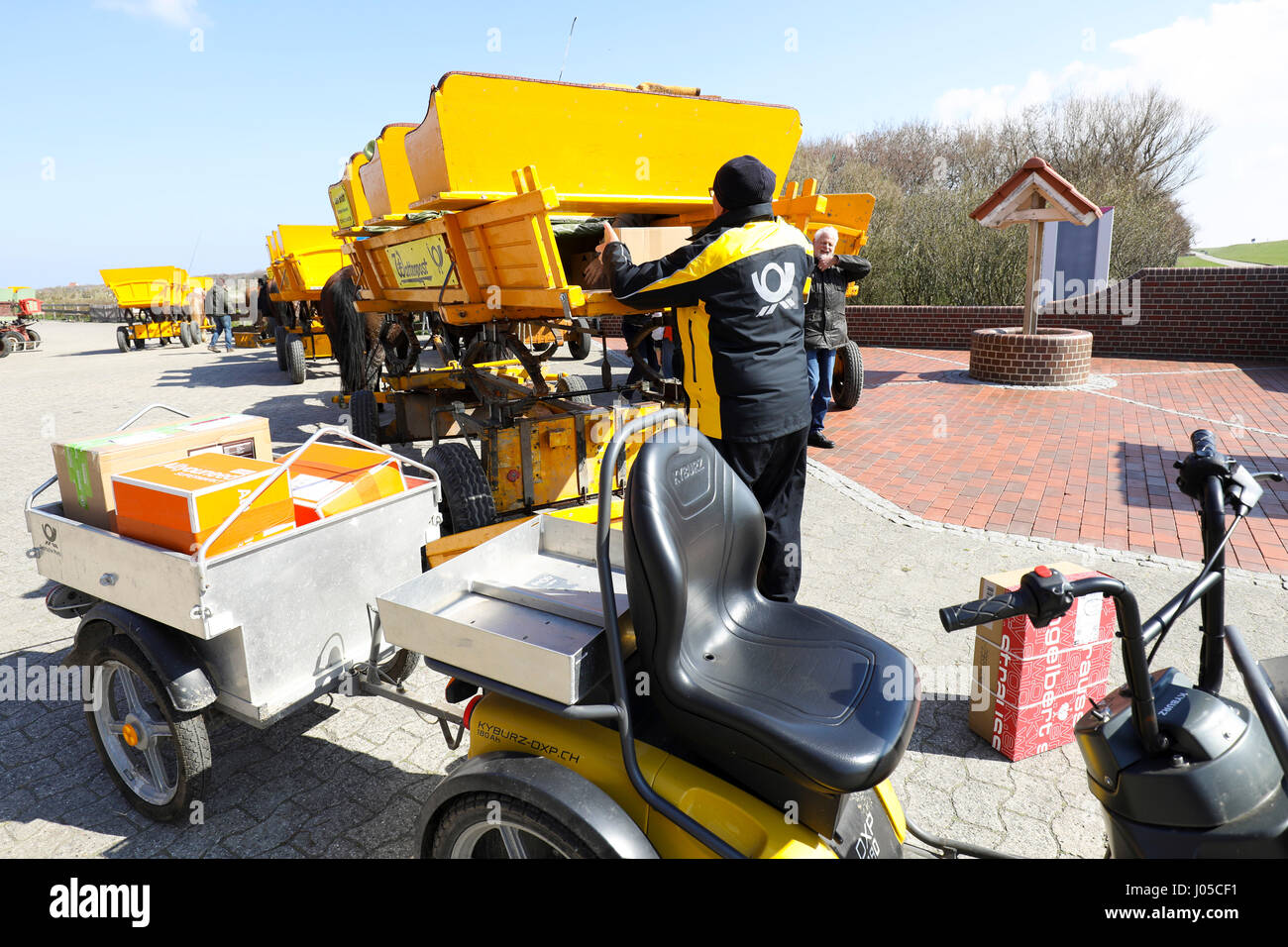 Mailman Michael Stobbe delivers the mail with his electric vehicle on ...