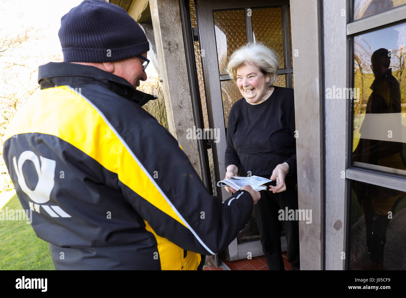 Mailman Michael Stobbe delivers the mail with his electric vehicle on ...