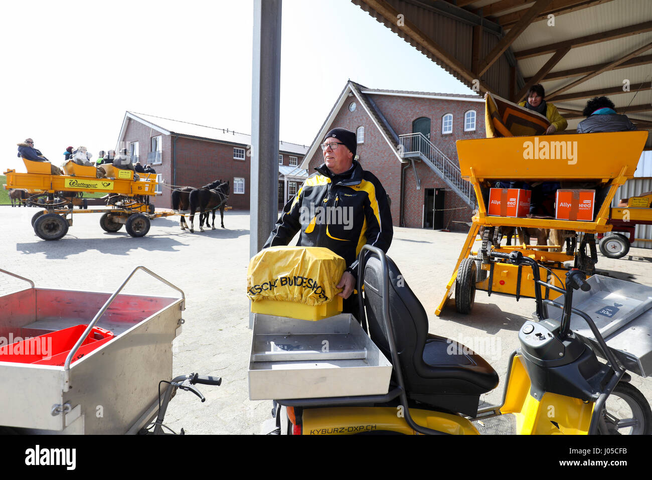 Mailman Michael Stobbe delivers the mail with his electric vehicle on ...