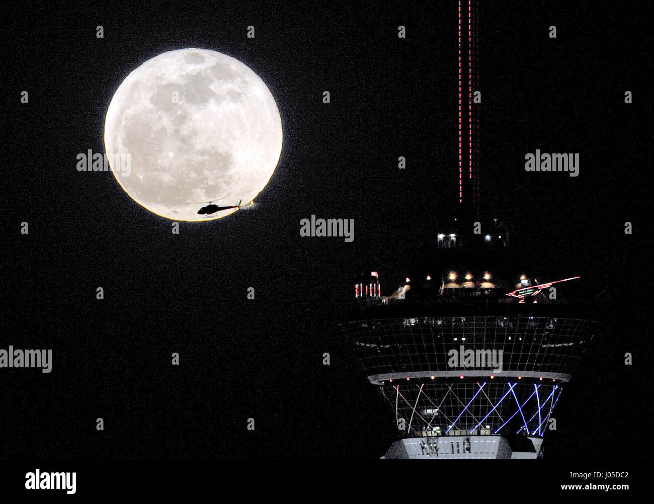 Las Vegas, Nevada, USA. 25th Apr, 2013. A helicopter flies by a full ...