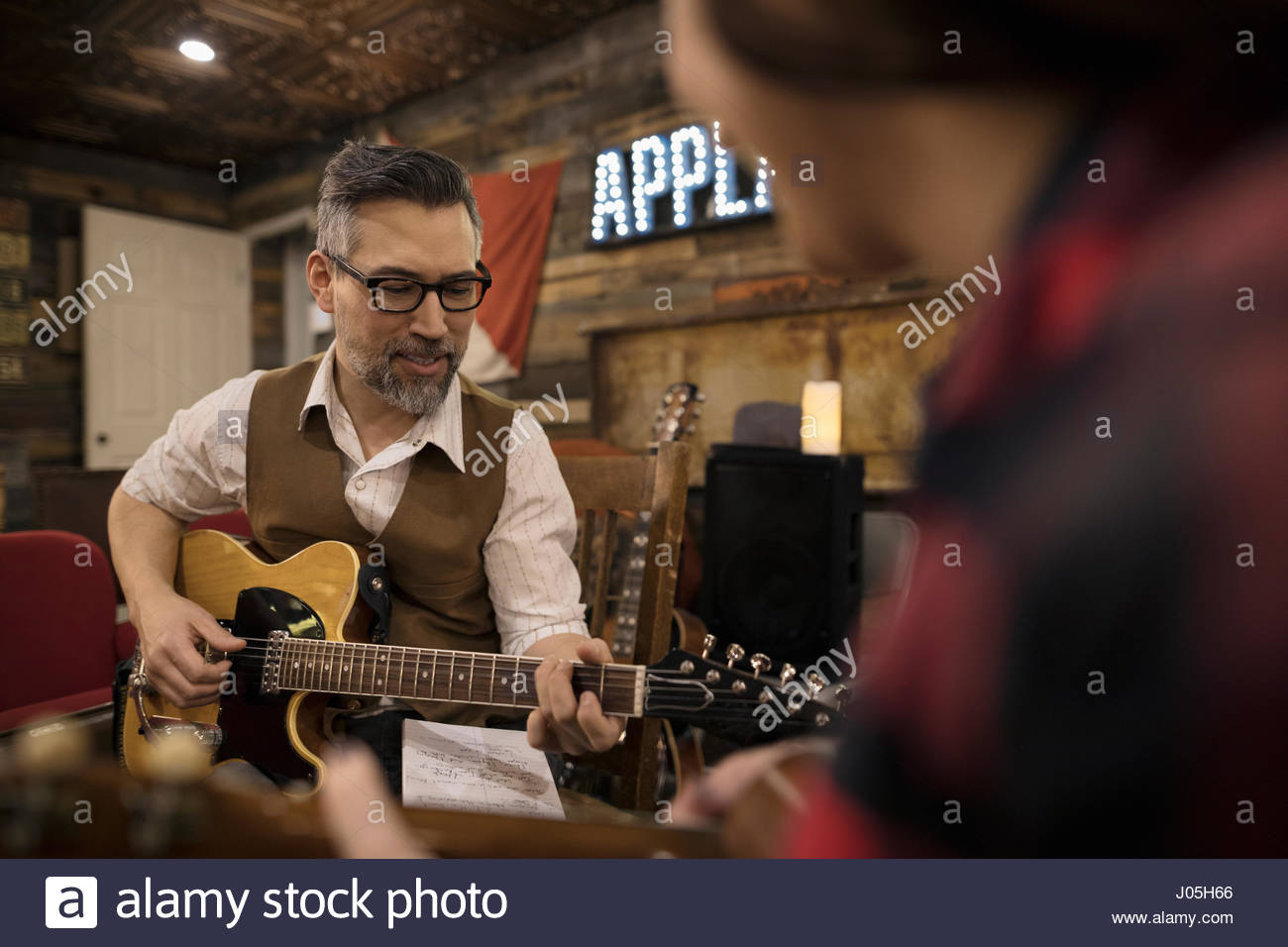 Man guitar over shoulder hi-res stock photography and images - Alamy