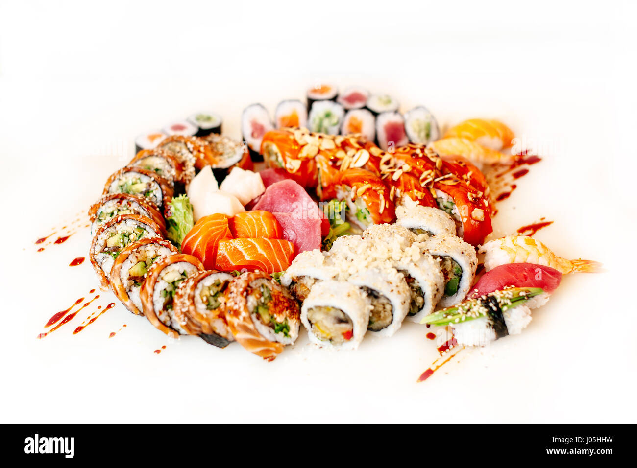 Sushi standing on white background table Stock Photo - Alamy