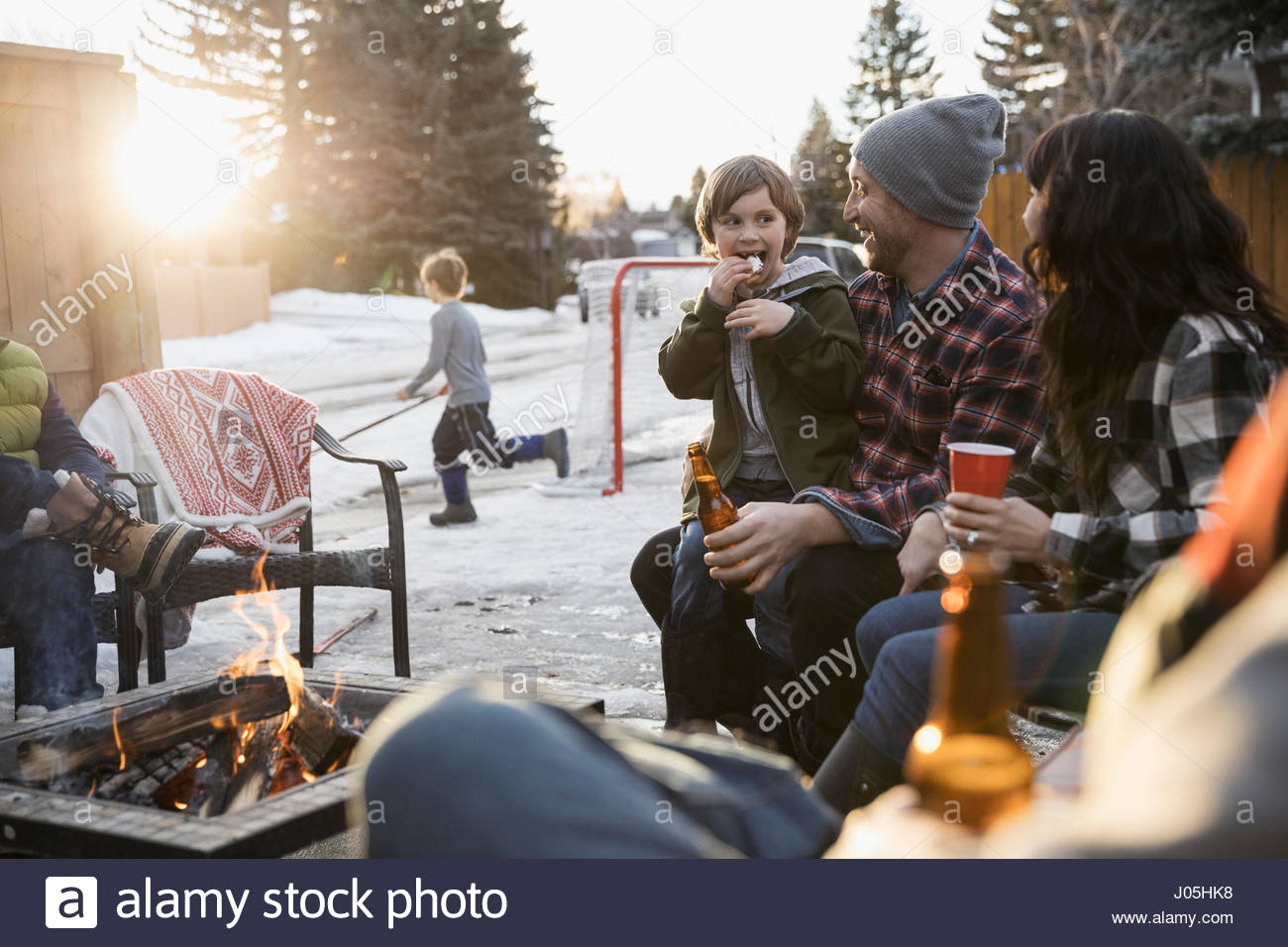 Sitting around fire pit hi-res stock photography and images - Alamy