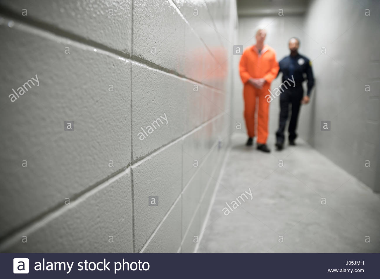 Two men walking prison hi-res stock photography and images - Alamy