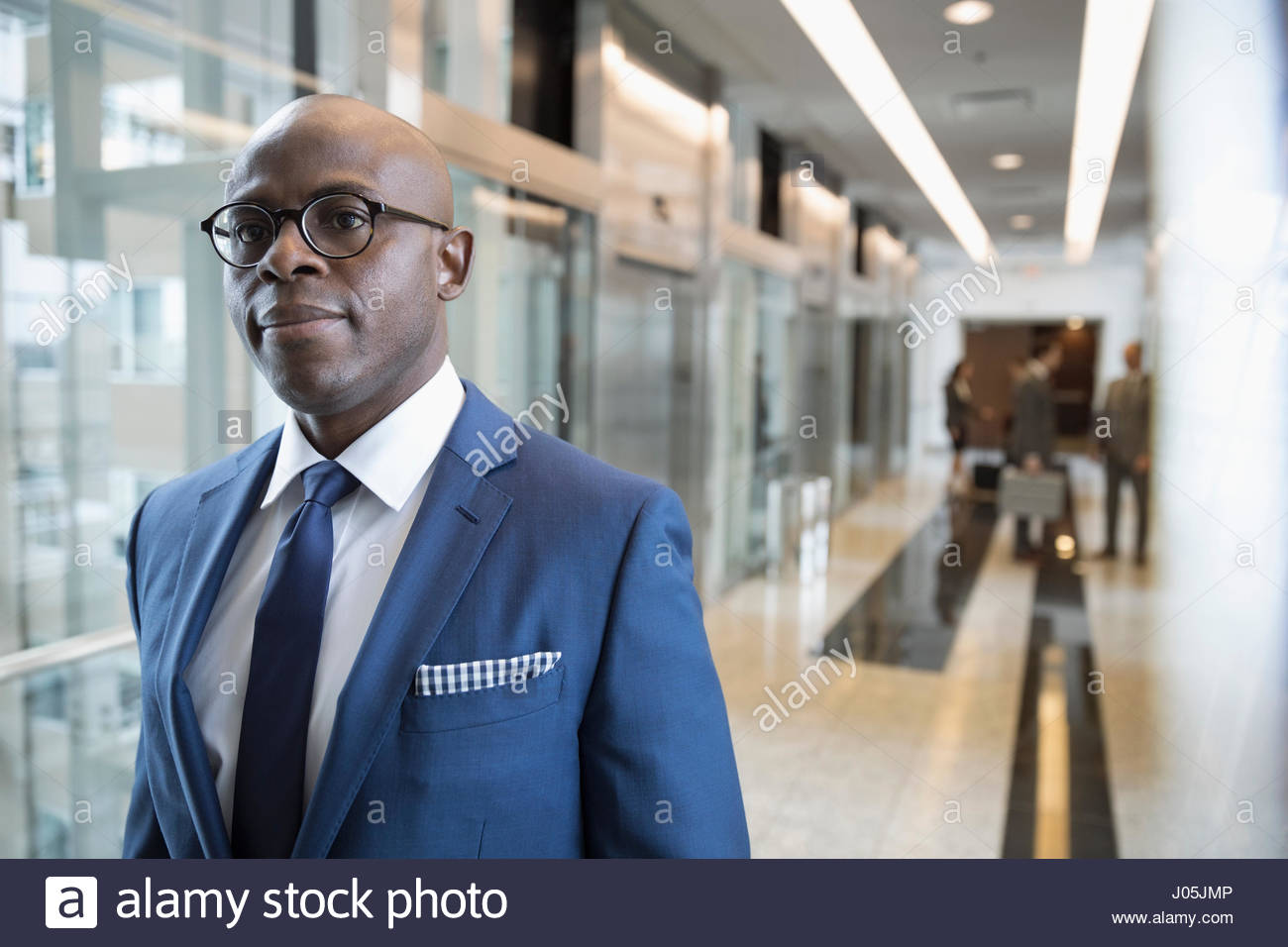 Male attorney in courthouse corridor Stock Photo - Alamy