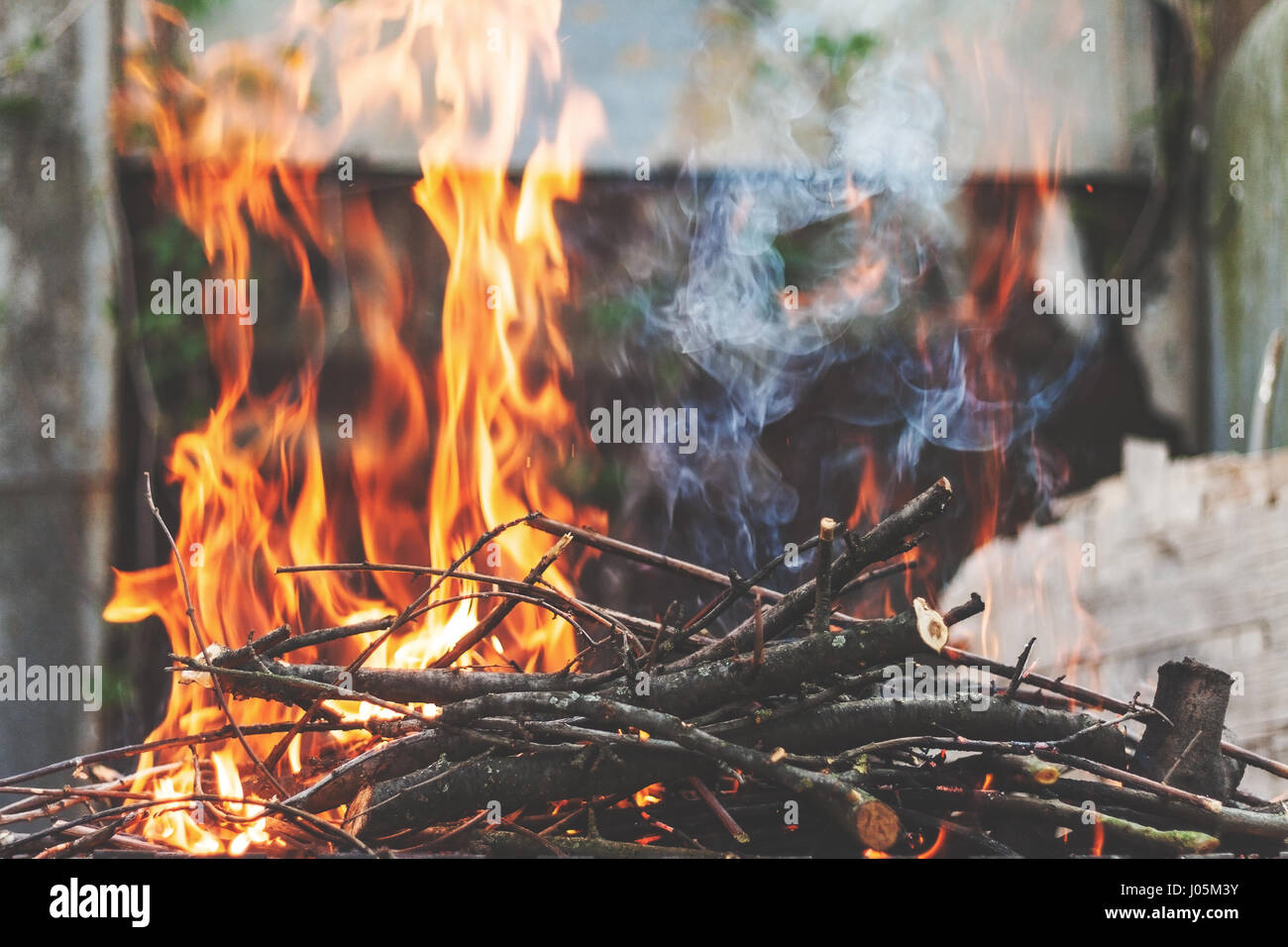 Firewood and branches for coals burn out in the brazier. Retro vintage ...