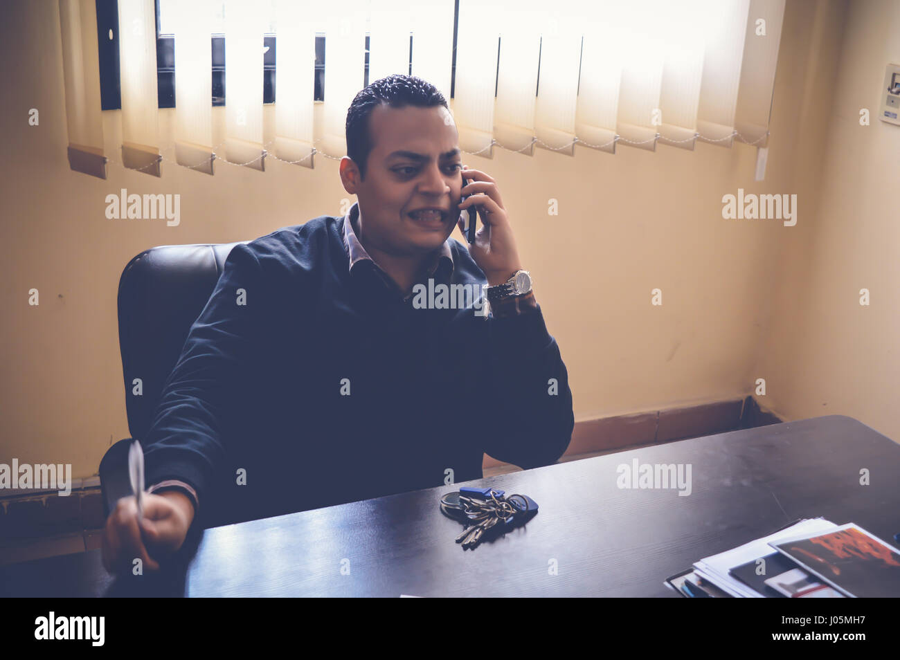 business man angry at mobile phone call Stock Photo - Alamy