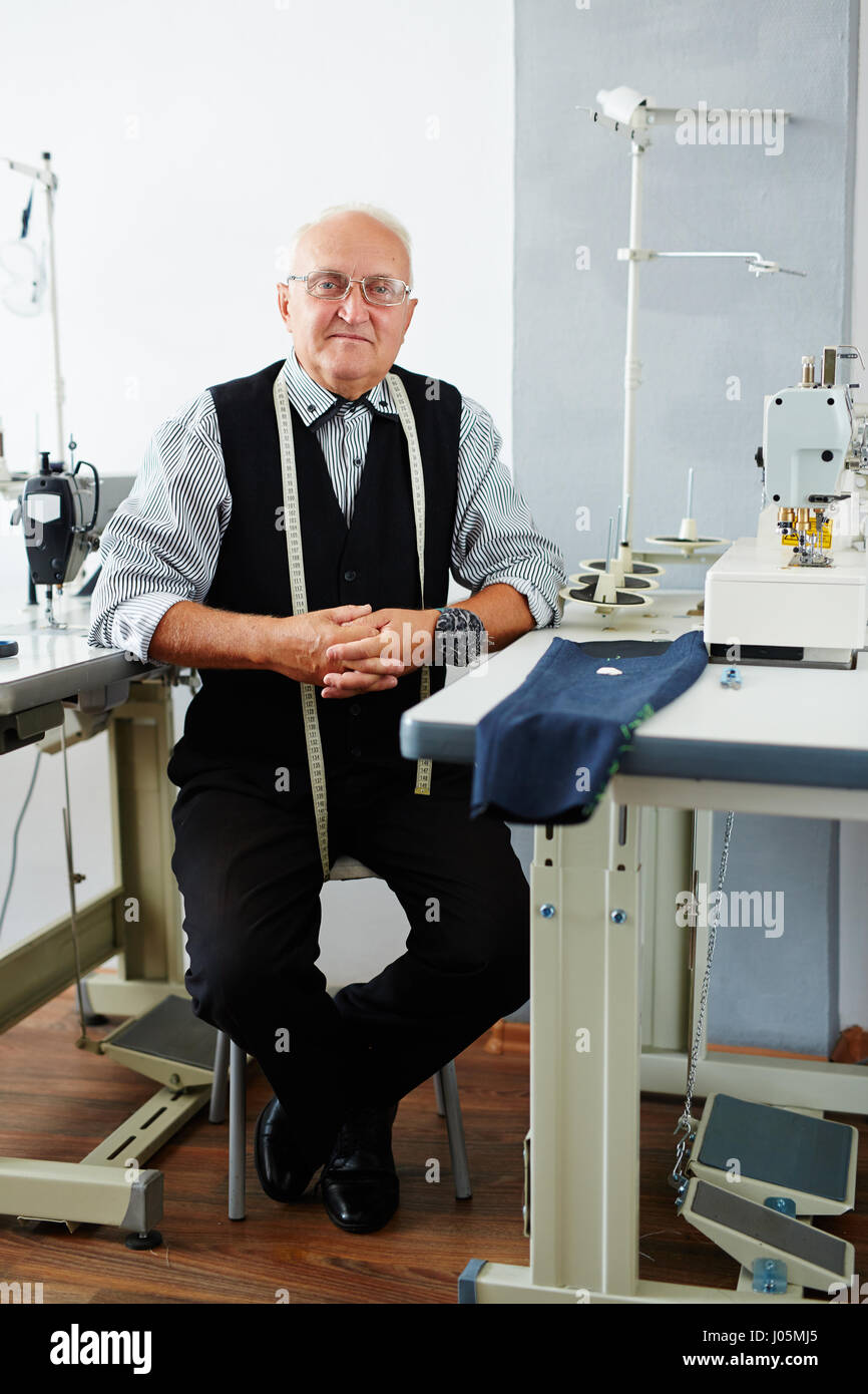 Tailor sitting hi-res stock photography and images - Alamy