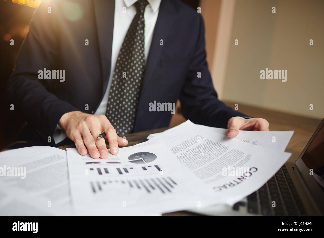Closeup portrait of unrecognizable successful businessman reviewing ...