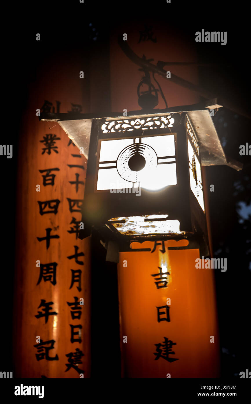 Decorative lamp at tunnel of torii gates at Fushimi Inari shrine in ...