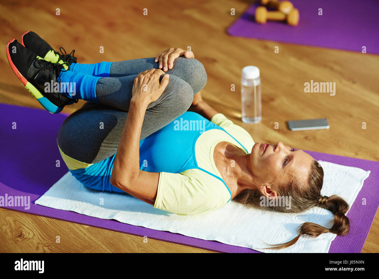 Knees to chest hi-res stock photography and images - Alamy