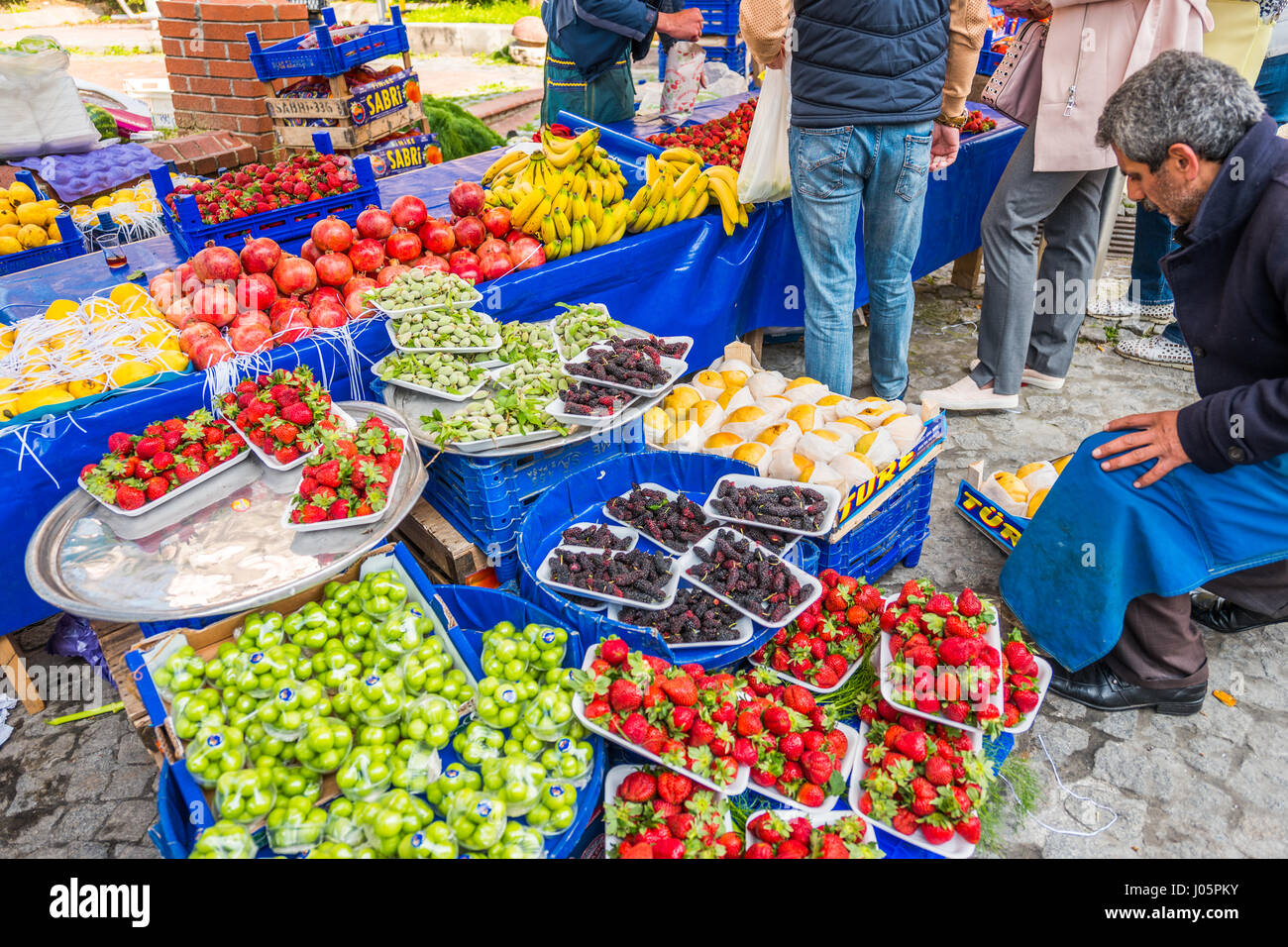 Colorful fruit and vegetable market with people shopping in Istanbul ...