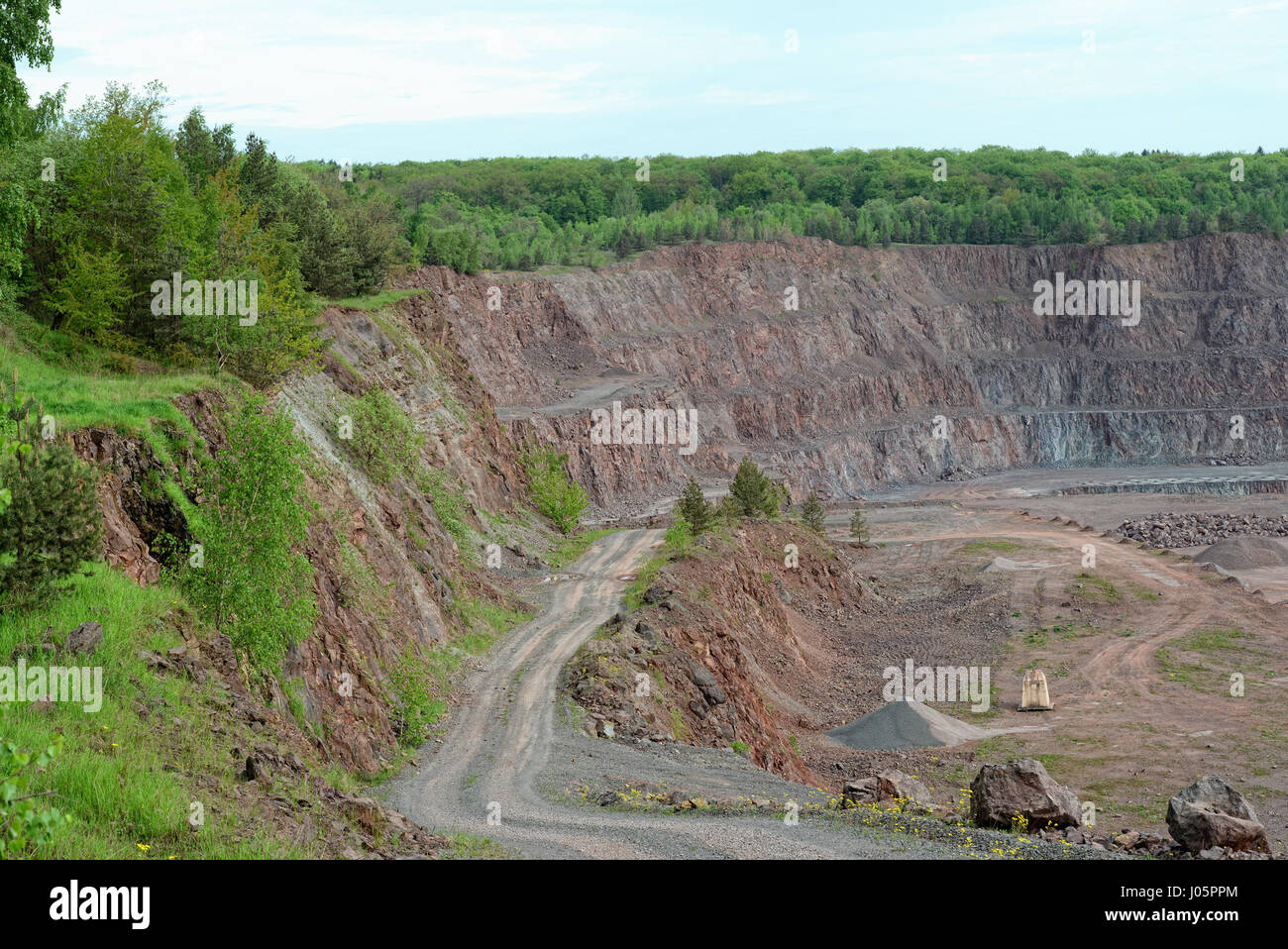 aerial view over a quarry hole. mining industry Stock Photo - Alamy