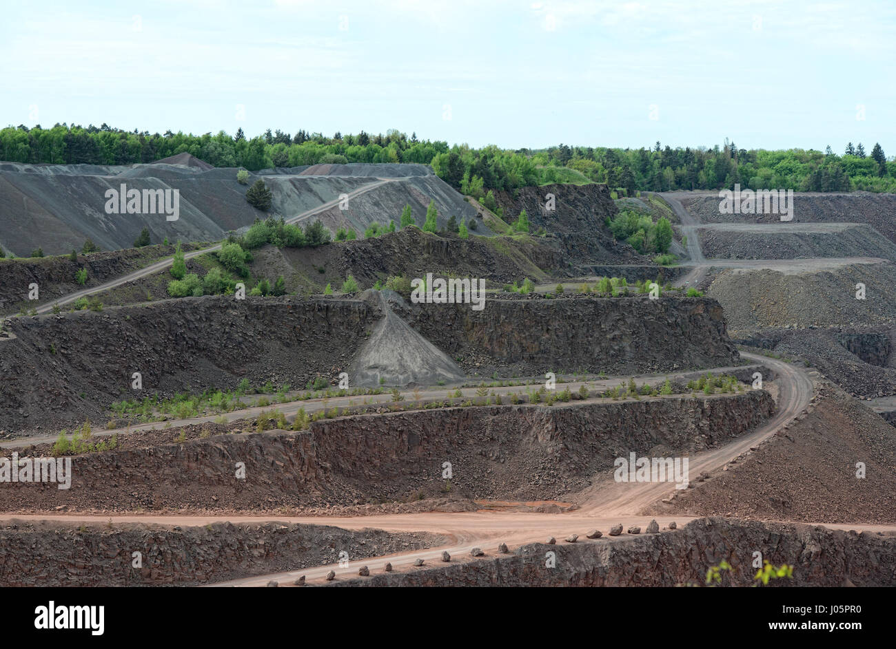 aerial view over a quarry hole. mining industry Stock Photo - Alamy