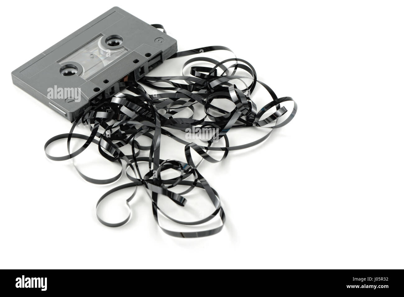 vintage audio cassette with tangled messy tape. white isolated ...
