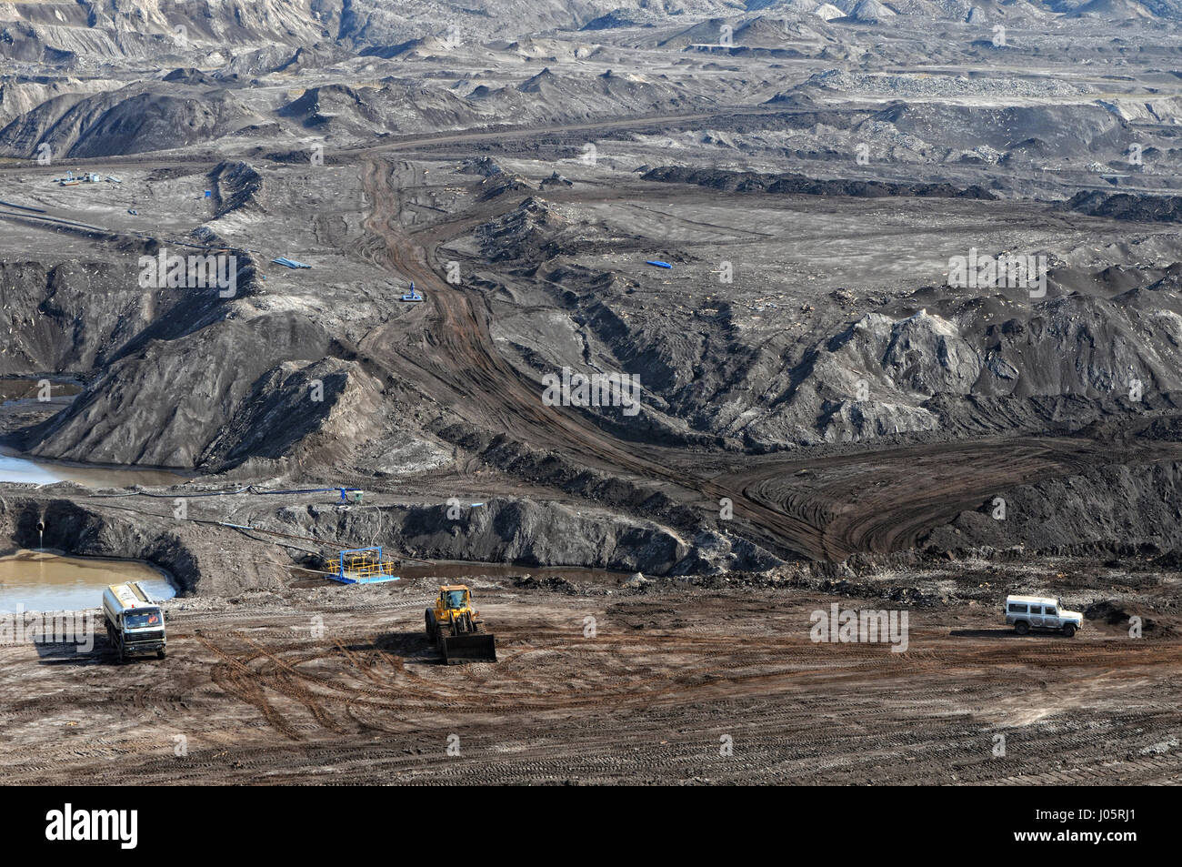 coal mine with excavator machine. mining industry Stock Photo - Alamy