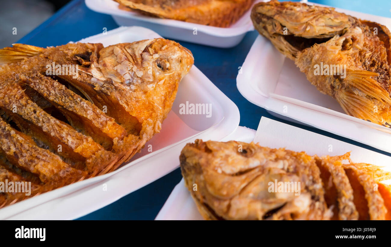 Fried tilapia in box, Fish fried Stock Photo - Alamy