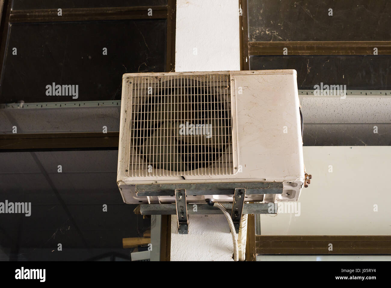Air conditioner compressor installed on a building Stock Photo - Alamy