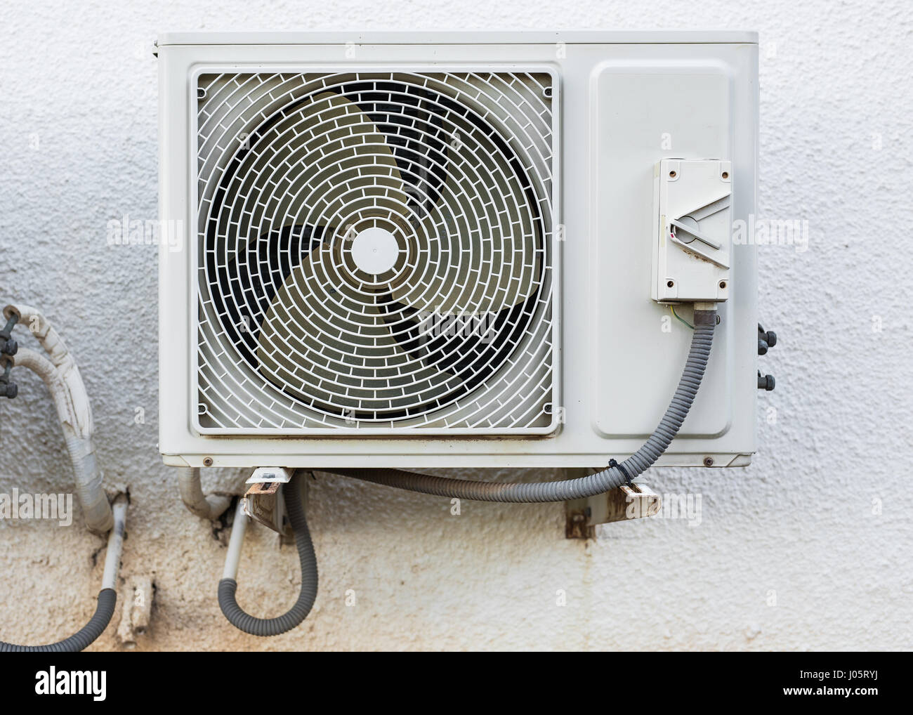 Air conditioner compressor installed on a building Stock Photo - Alamy