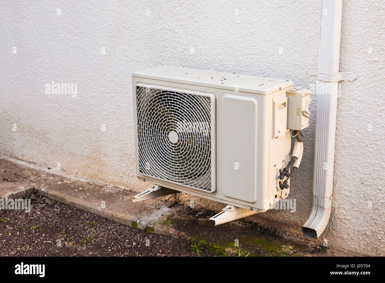 Air conditioner compressor installed on a building Stock Photo - Alamy