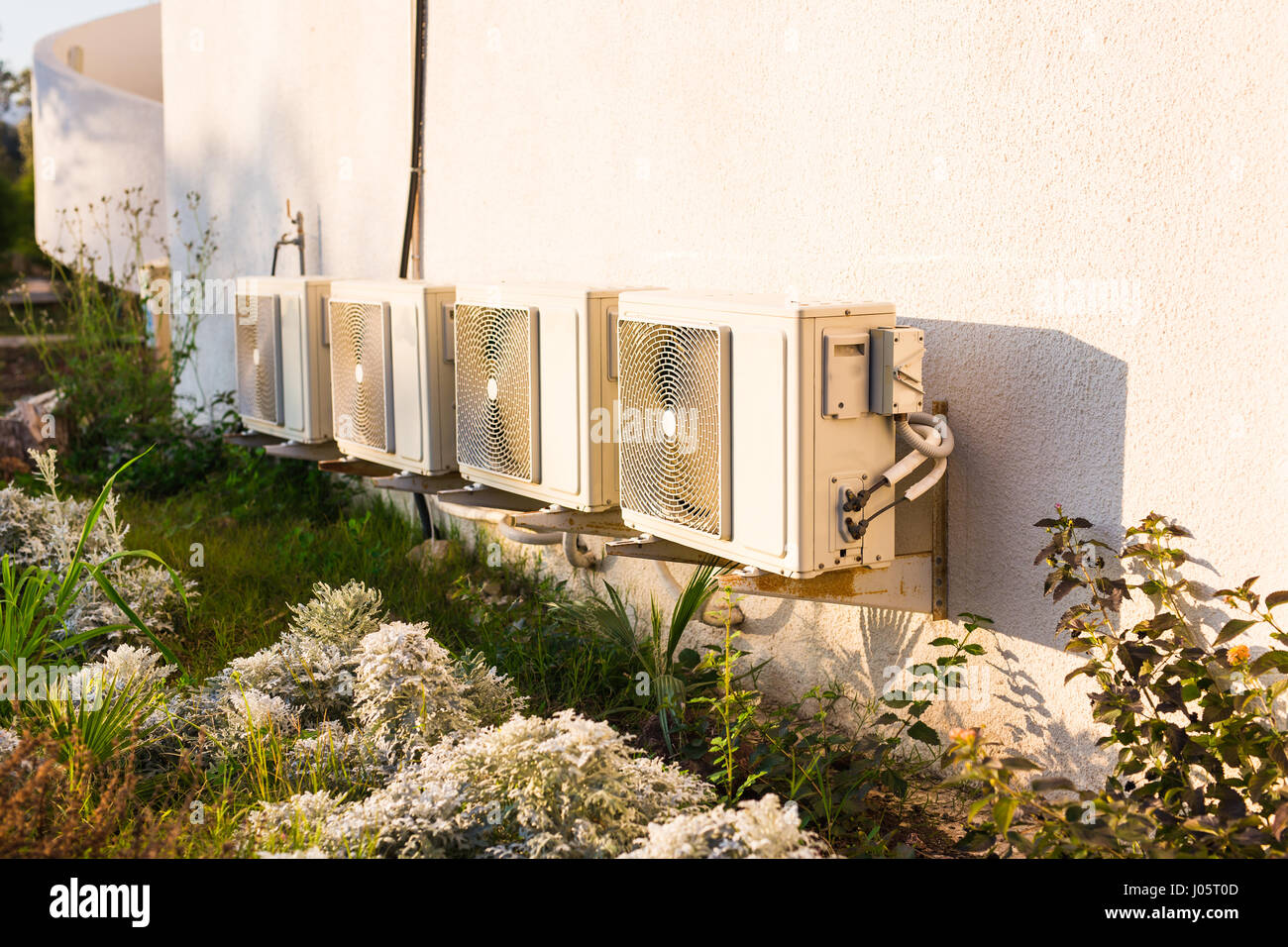 Air conditioner compressor installed on a building Stock Photo - Alamy