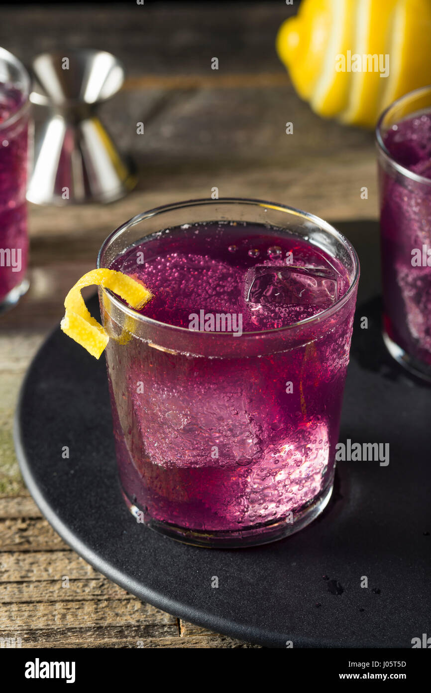 Homemade Purple Haze Cocktail with a Lemon Garnish Stock Photo - Alamy