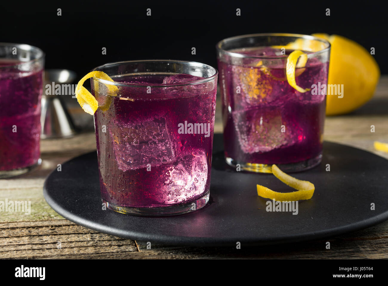 Homemade Purple Haze Cocktail with a Lemon Garnish Stock Photo - Alamy