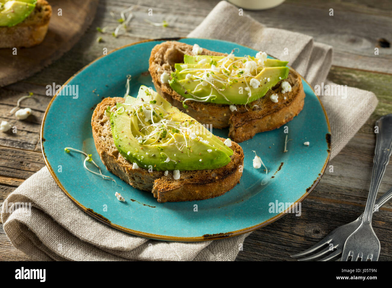 Healthy Homemade Avocado Toast with Cheese and Sprouts Stock Photo - Alamy