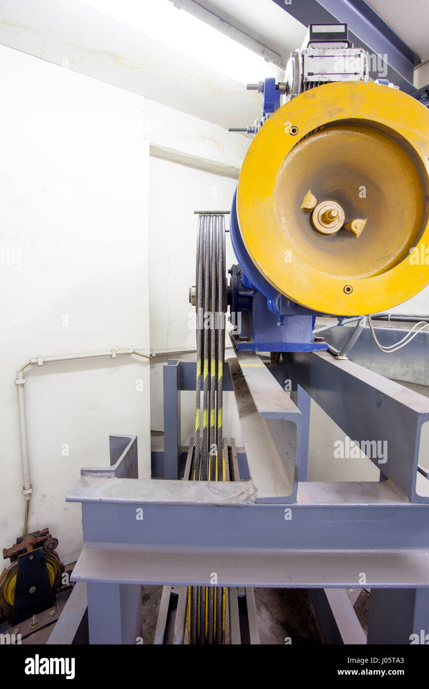 iron cables on a wheel of a motor of the elevator Stock Photo - Alamy