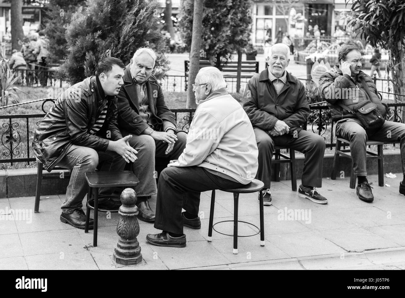 Men talking in a park in Istanbul, Turkey Stock Photo - Alamy