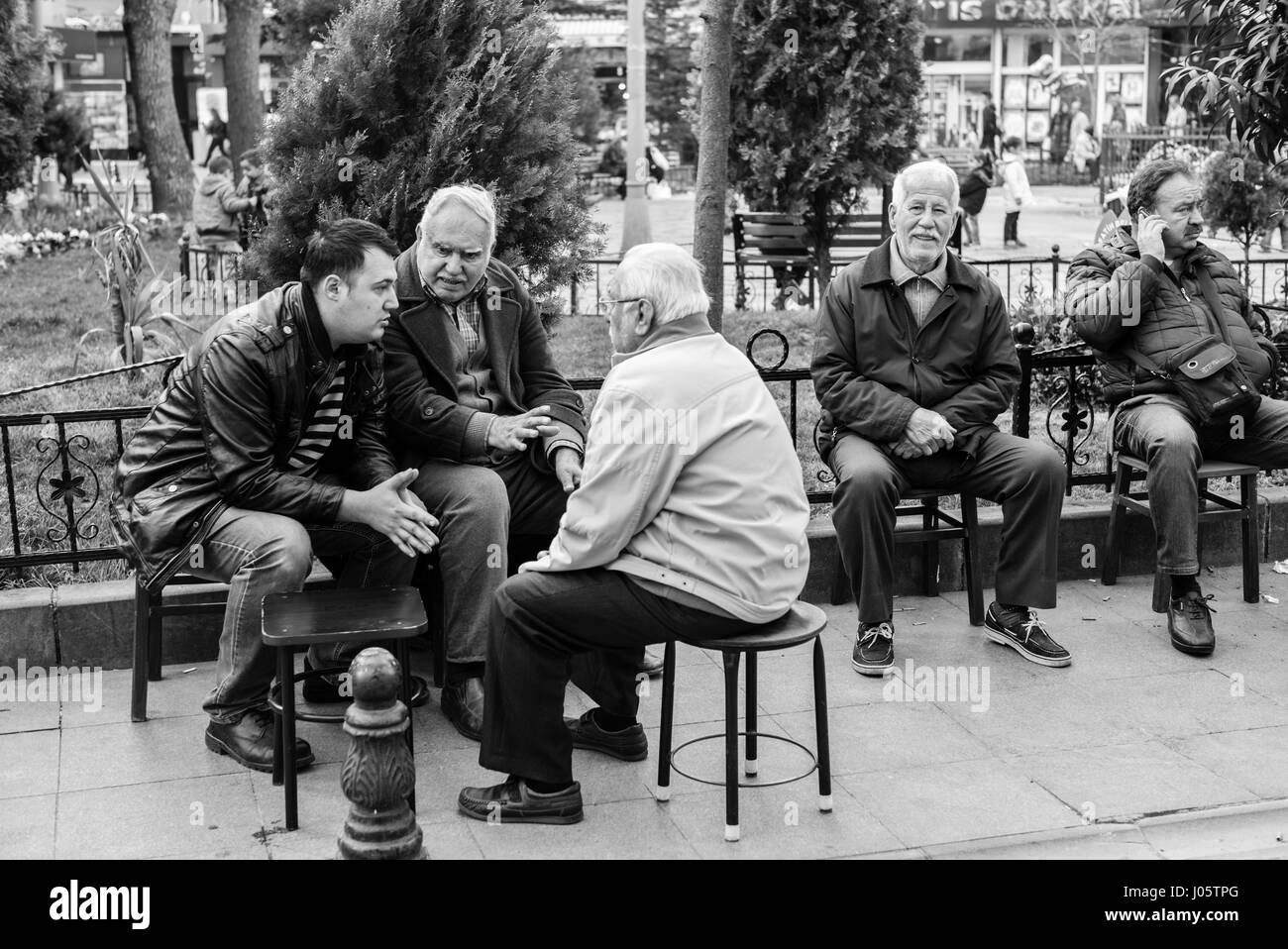 Men talking in a park in Istanbul, Turkey Stock Photo - Alamy