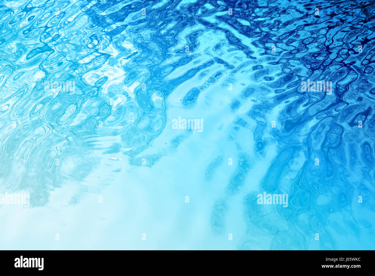 Photo of a blue bright water texture Stock Photo - Alamy