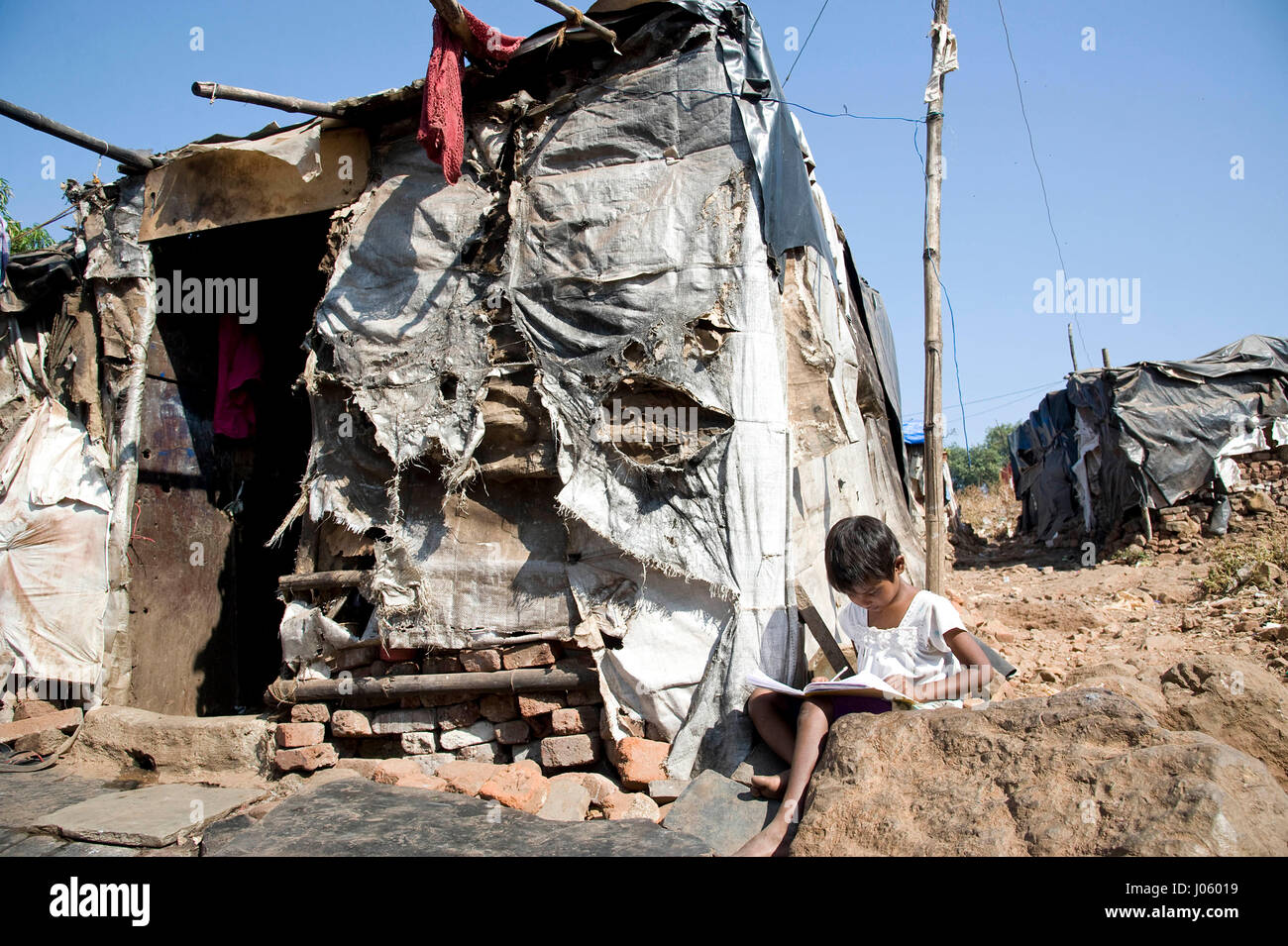Poor kid studying hi-res stock photography and images - Alamy