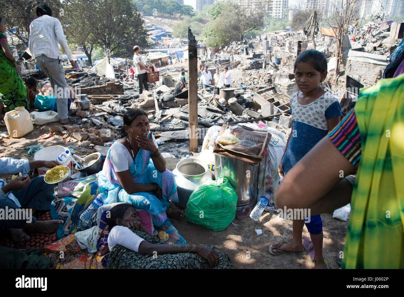 Women resting after slum fire, damu nagar, kandivali, mumbai ...