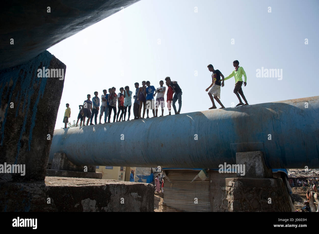 Boys on water pipe line, damu nagar, kandivali, mumbai, maharashtra ...