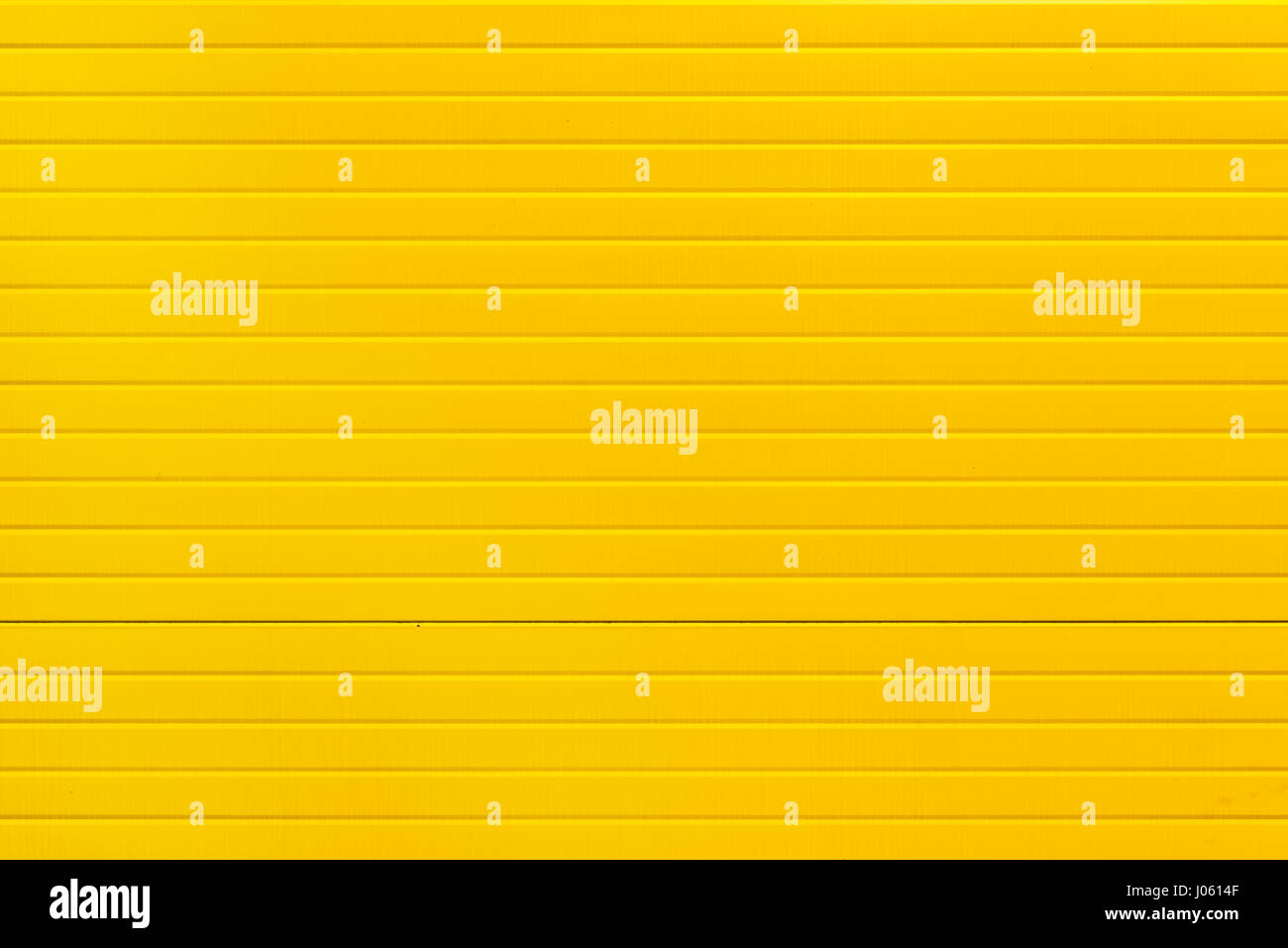 Yellow warehouse wall, metal plated surface of storage building facade ...