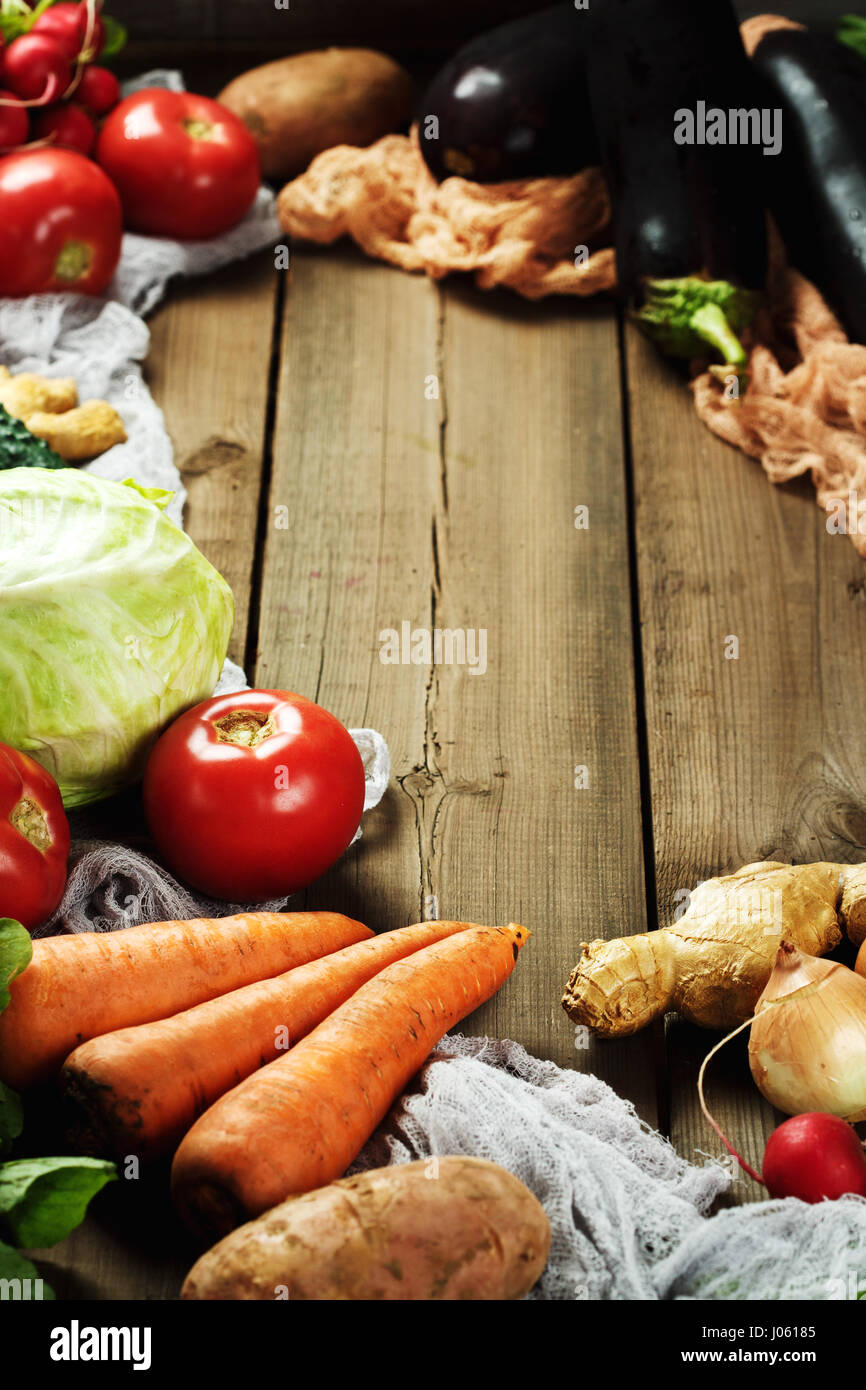 Frame made from fresh vegetables on wooden rustic table. Top view ...