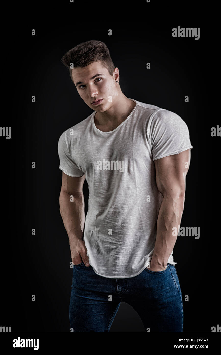Handsome young muscular man looking at camera Stock Photo - Alamy